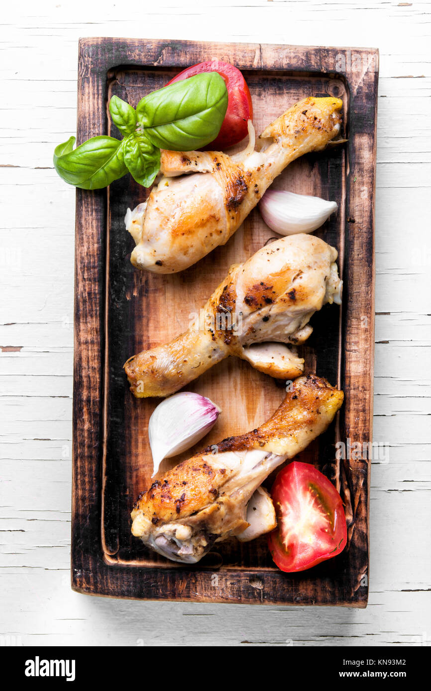 chicken legs on kitchen board in light background Stock Photo - Alamy