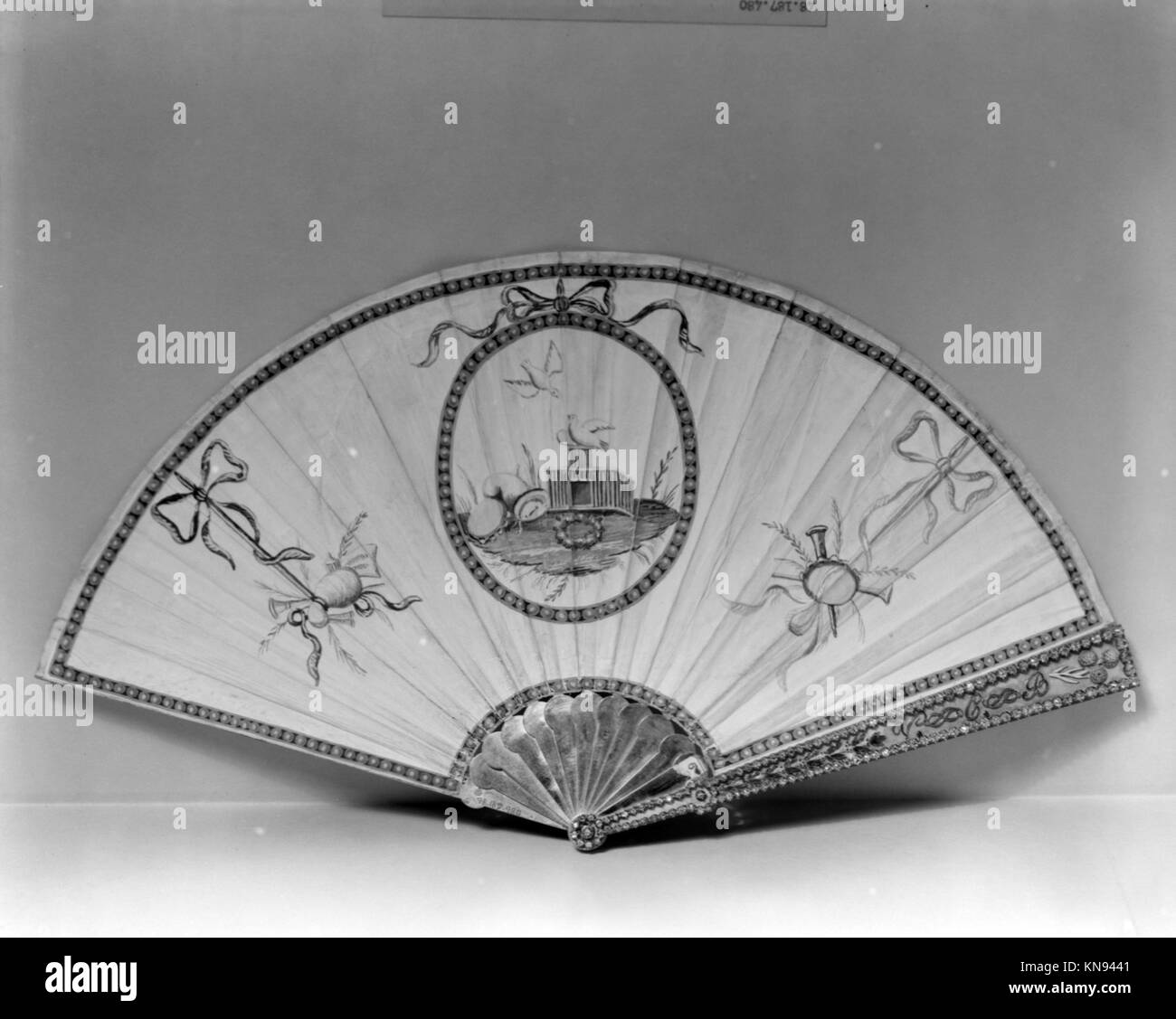 This fan, made of delicate materials, features intricate design ...