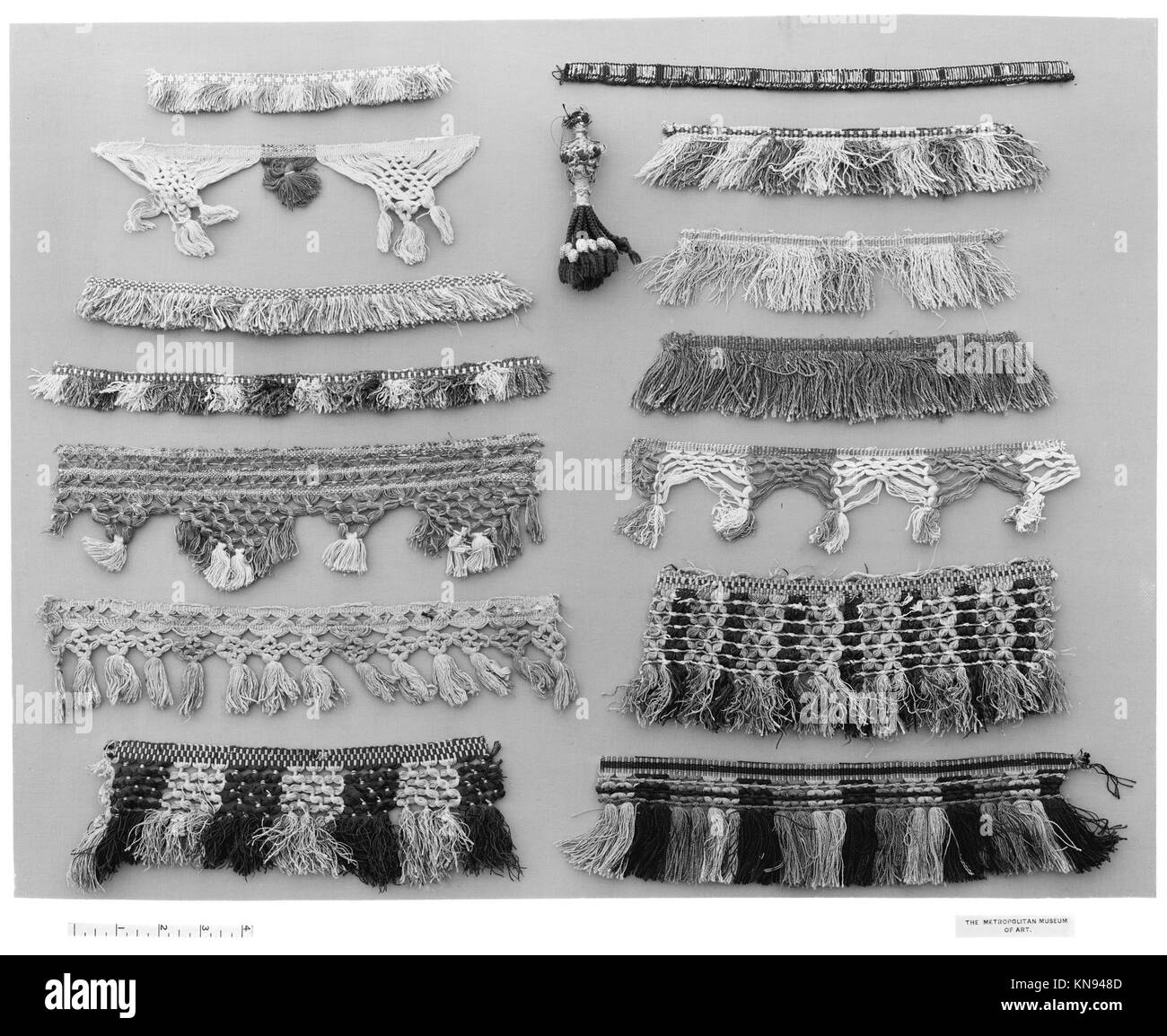 A gimp trim made of twisted thread, used in embroidery or clothing. It ...