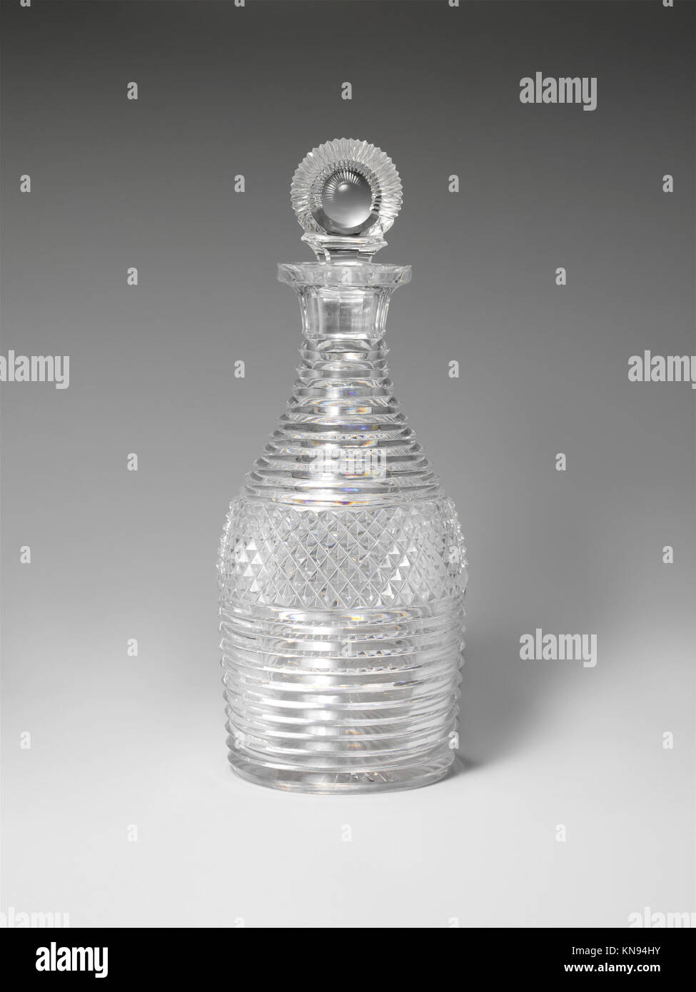 This glass decanter with a stopper is an example of elegant glassware ...