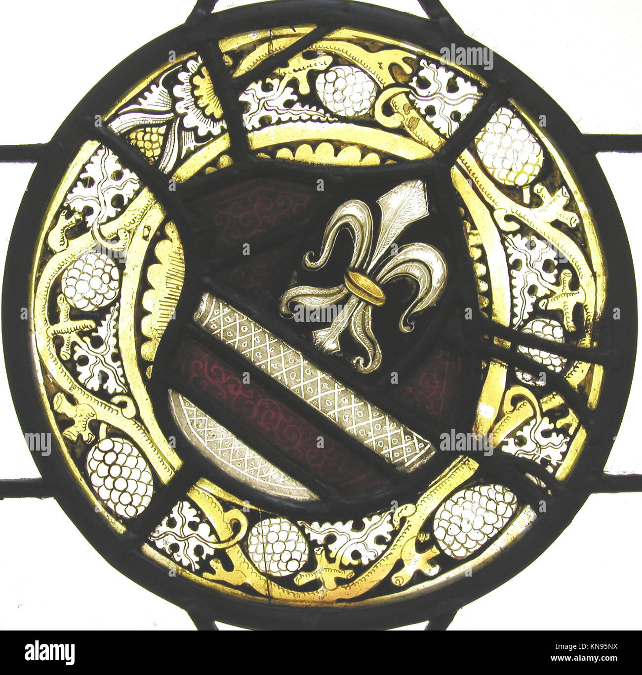This armorial roundel features heraldic imagery, likely symbolizing the ...