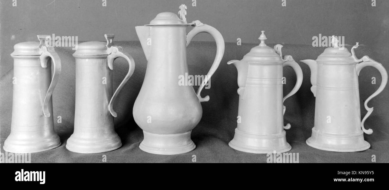 This 18th-century church flagon, crafted from pewter, is an example of ...