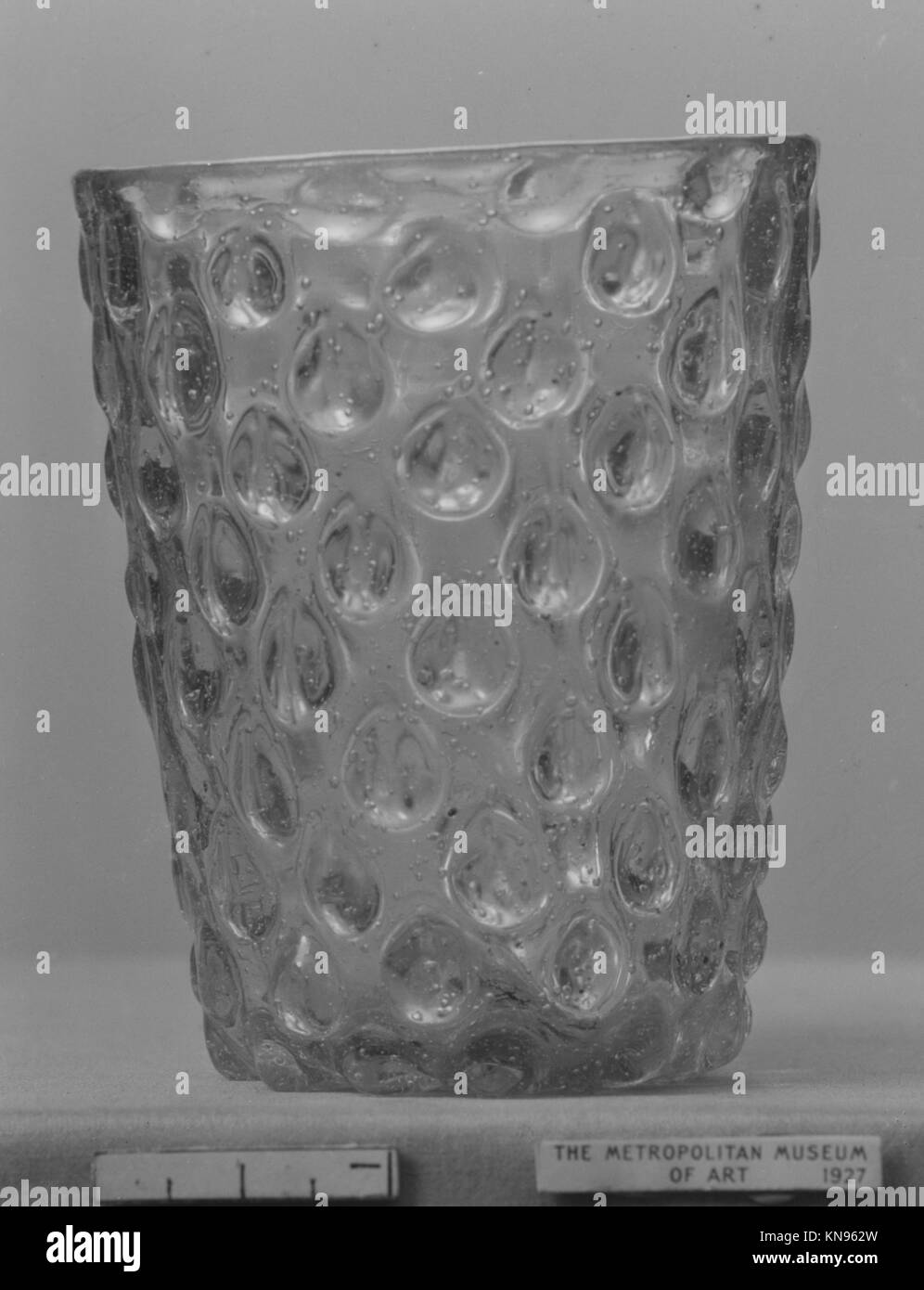 This beaker is a glass or ceramic drinking vessel, designed for daily ...