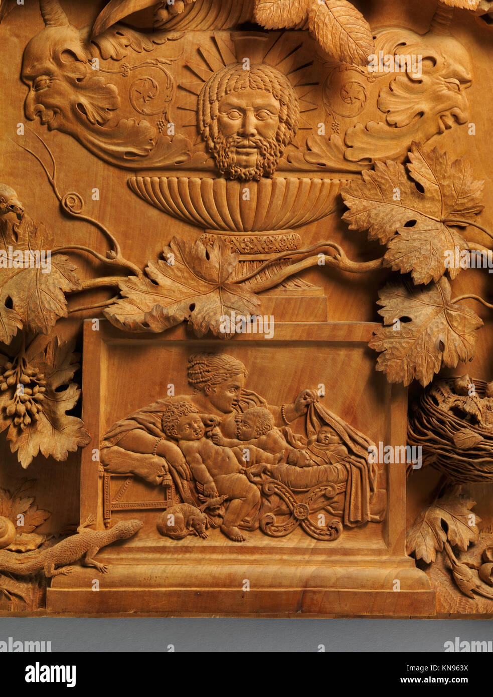 This floral still-life relief features intricate floral designs ...