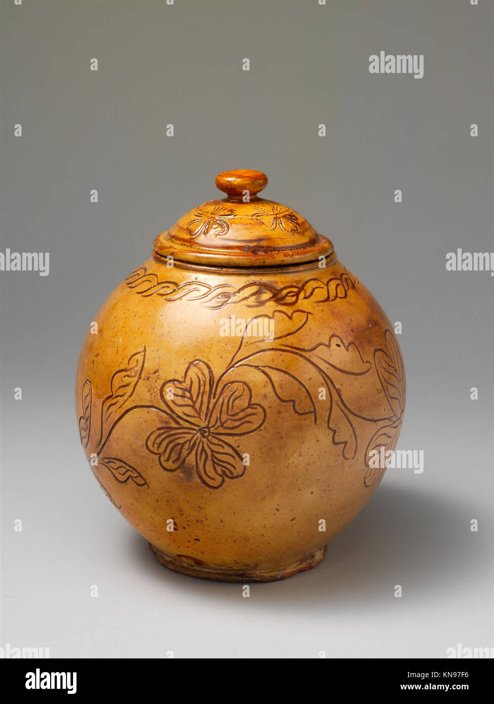 This redware covered jar by Jacob Scholl (1830–1840) features sgraffito ...
