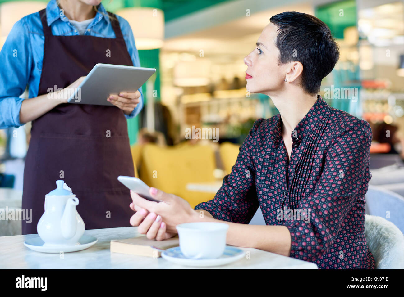 Woman ordering food hi-res stock photography and images - Alamy