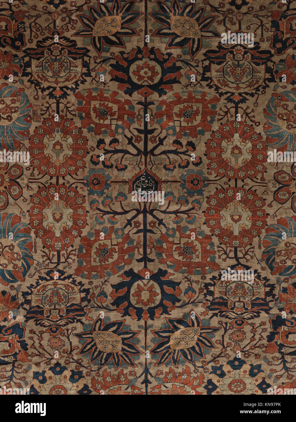 A Persian carpet, featuring intricate geometric and floral patterns ...