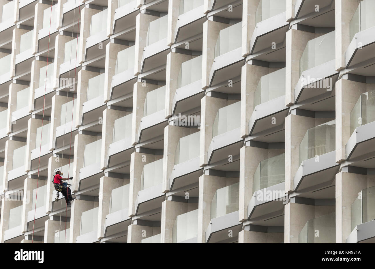 Man painting facade high rise building hi-res stock photography and ...