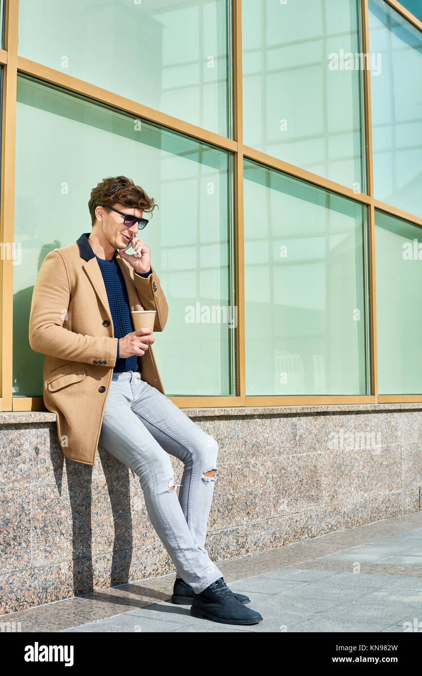 Handsome Young Man Speaking by Phone Stock Photo - Alamy