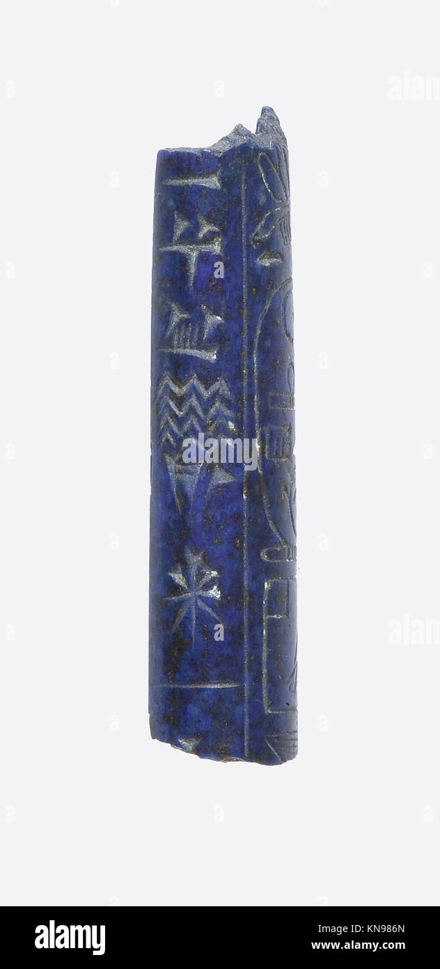 This bilingual cylinder seal features inscriptions in two languages ...