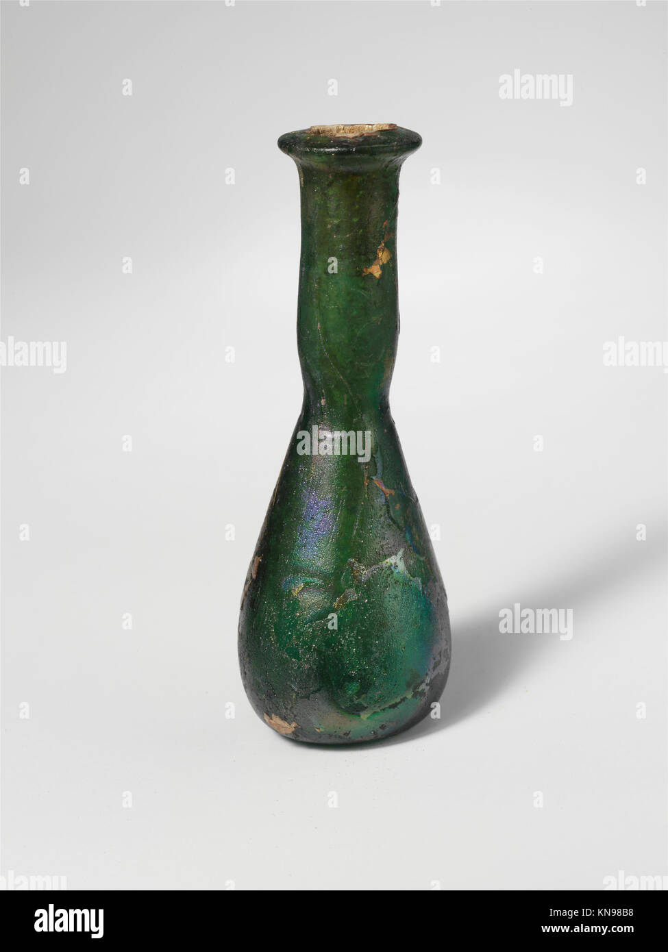 A glass perfume bottle exemplifying historical glassmaking ...