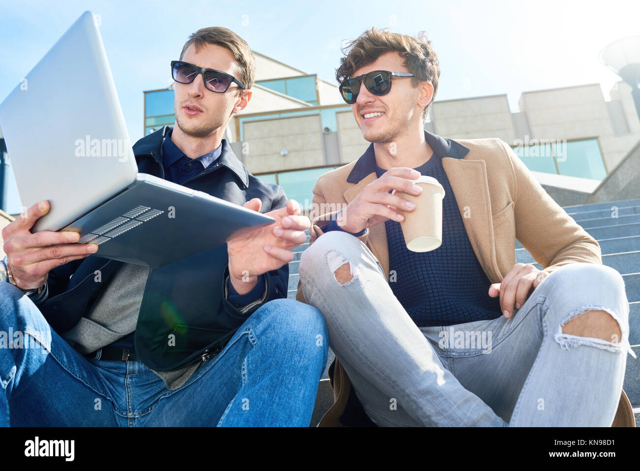 Modern Young Men Using Laptop in City Stock Photo - Alamy