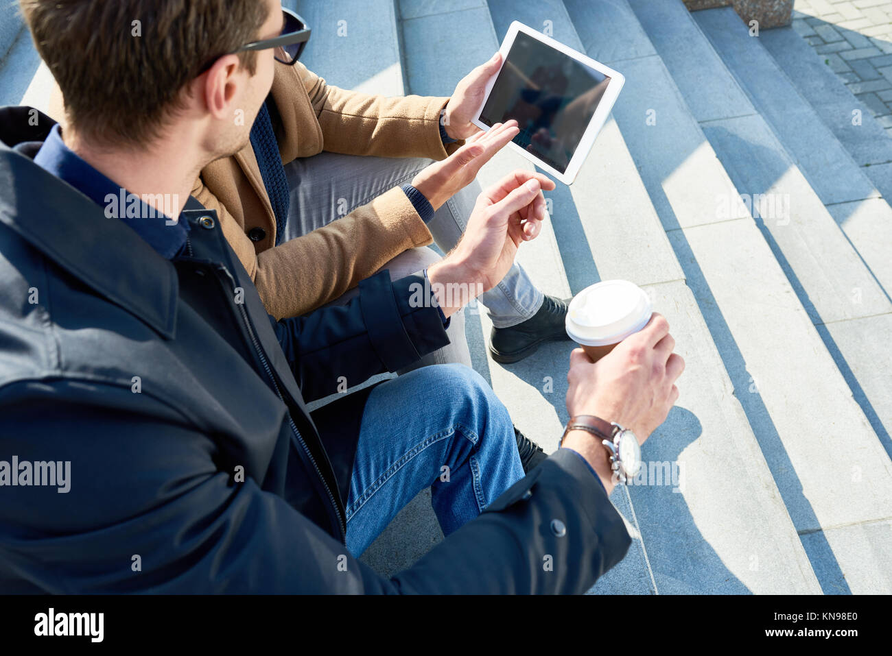 Two young handsome men using hi-res stock photography and images - Alamy