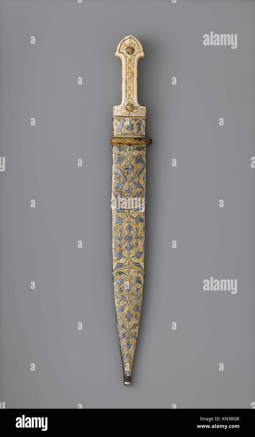 This Qama dagger features a sharp blade with a decorative sheath ...