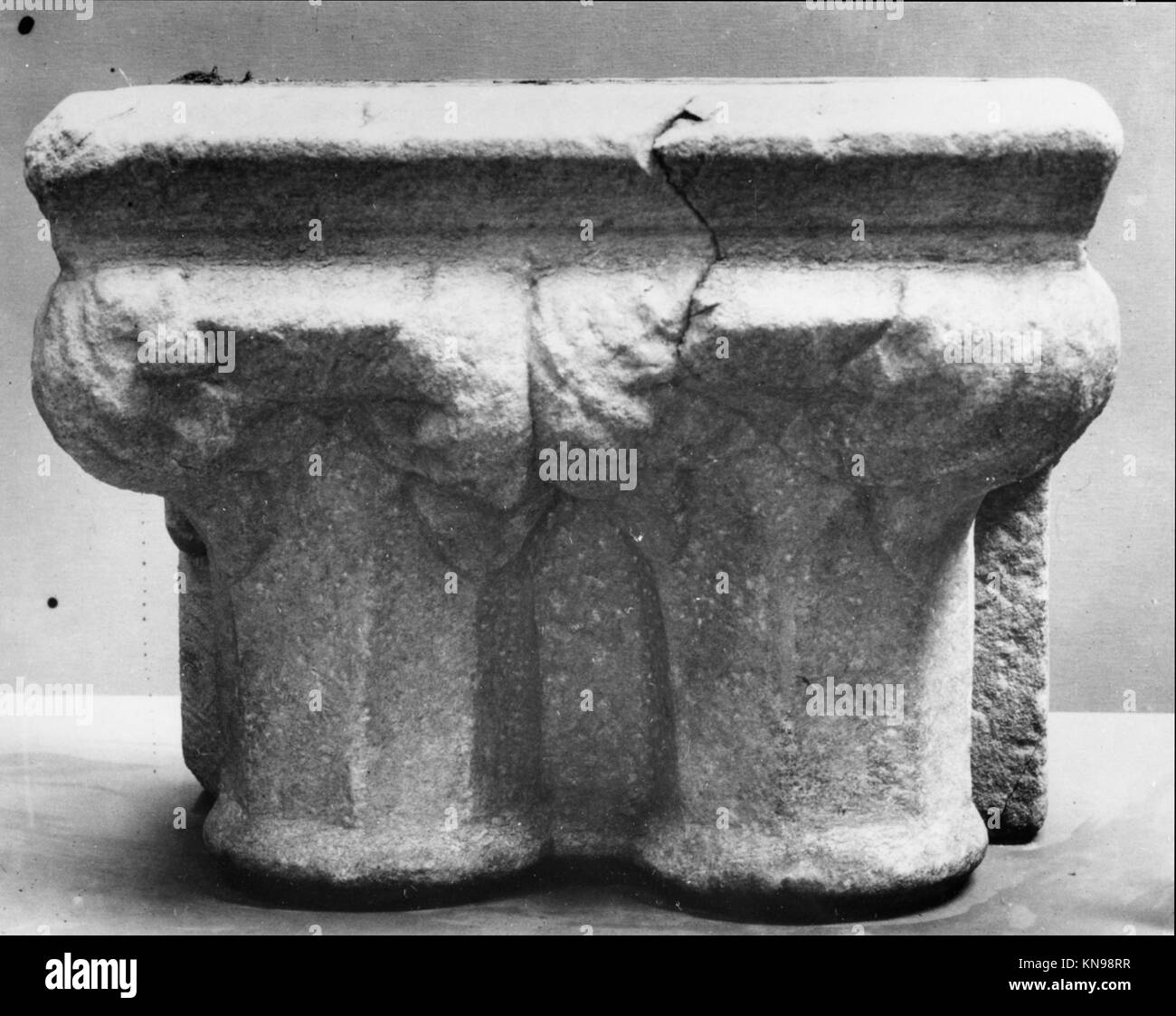 This piece represents a double-engaged capital with intricate details ...