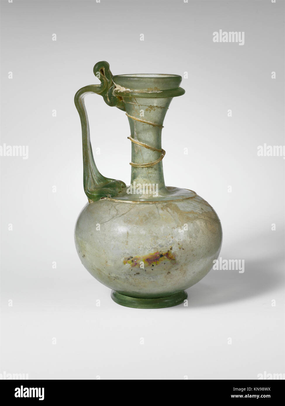 This glass jug, with its elegant form and functional design ...