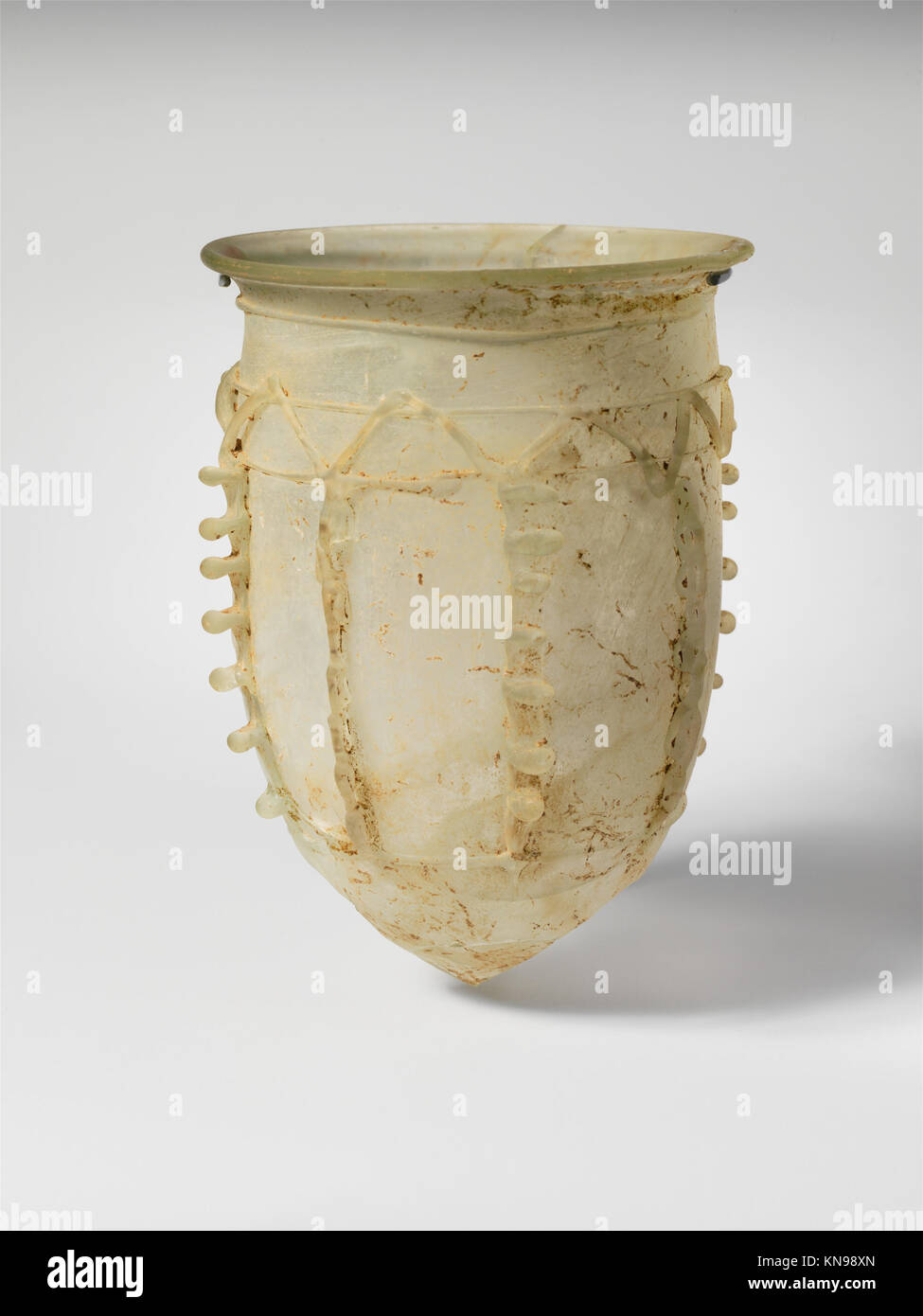 This glass beaker is a fine example of ancient craftsmanship, used for ...