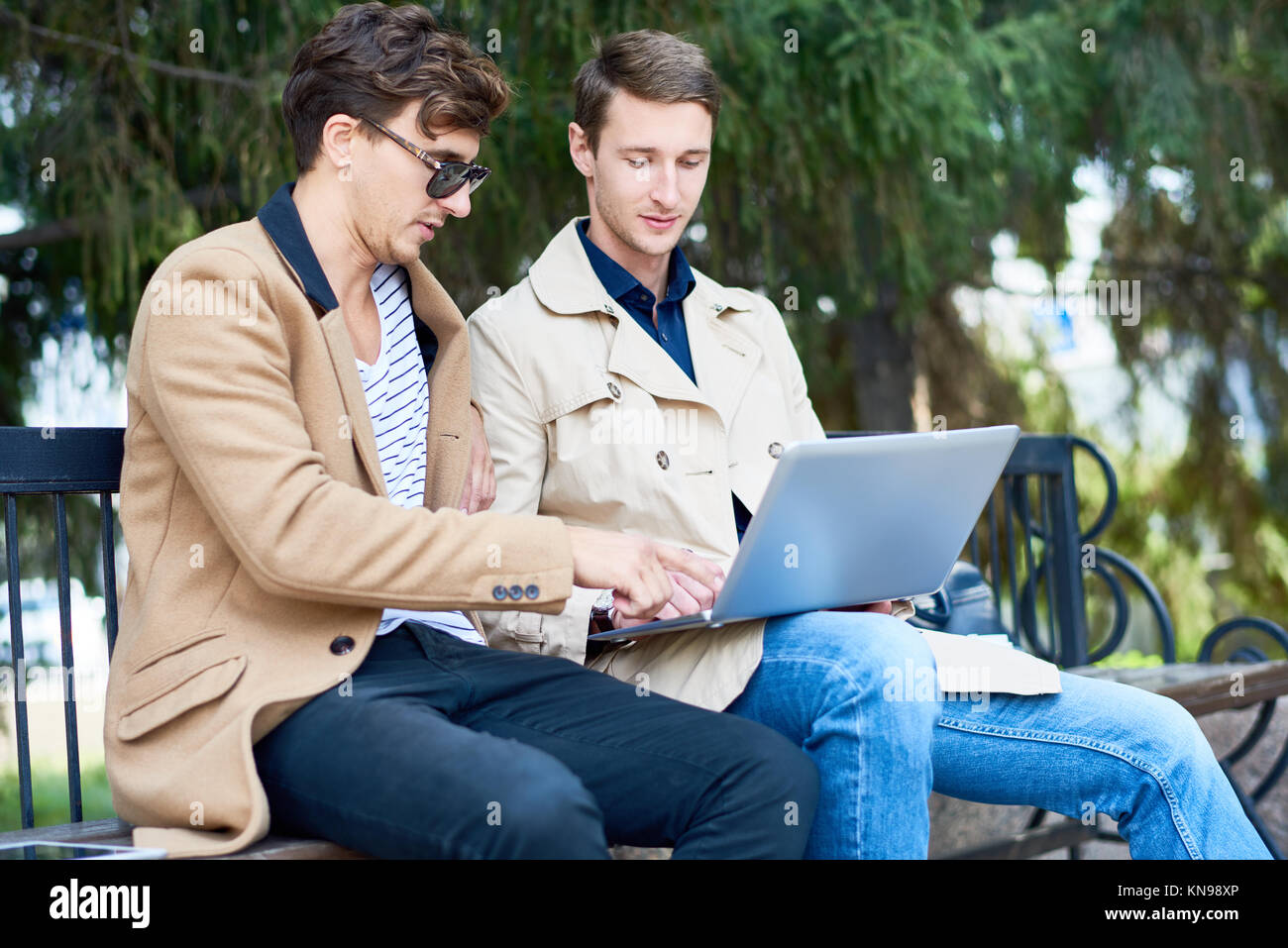 Two Business People Working in Park Stock Photo - Alamy