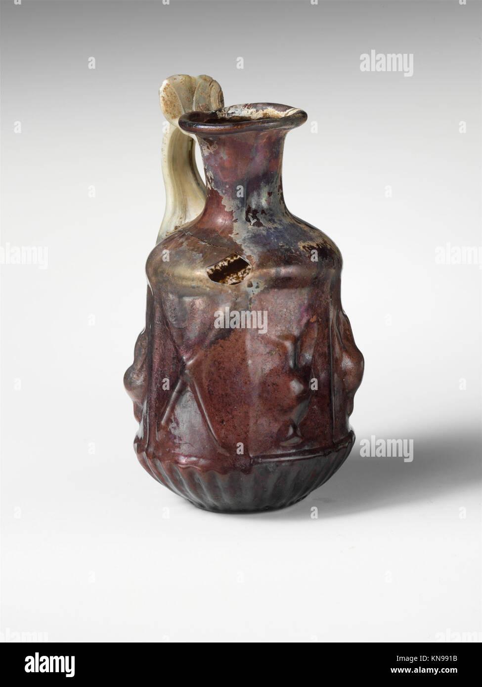 This glass jug depicts Dionysiac symbols, reflecting Dionysus's ...