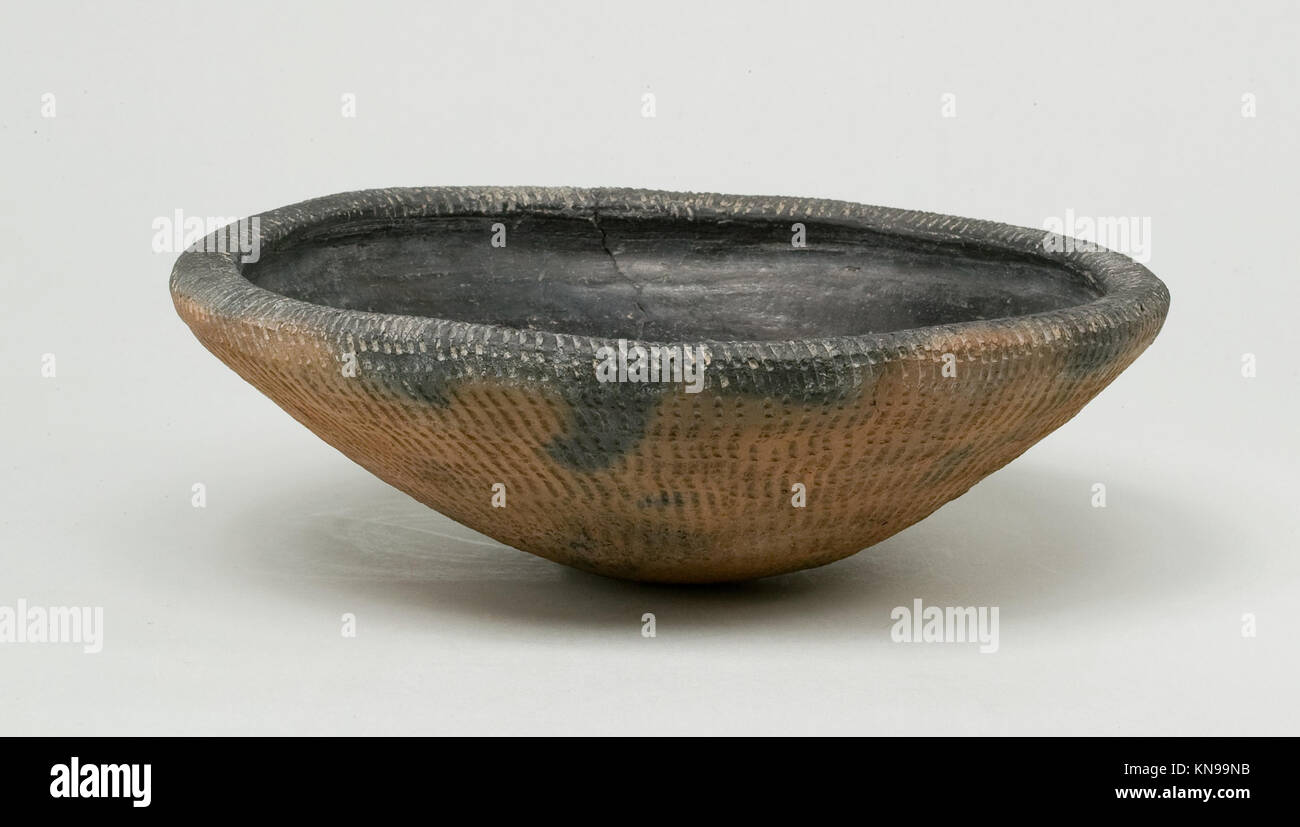 This bowl is a functional piece from an ancient culture, showcasing the ...