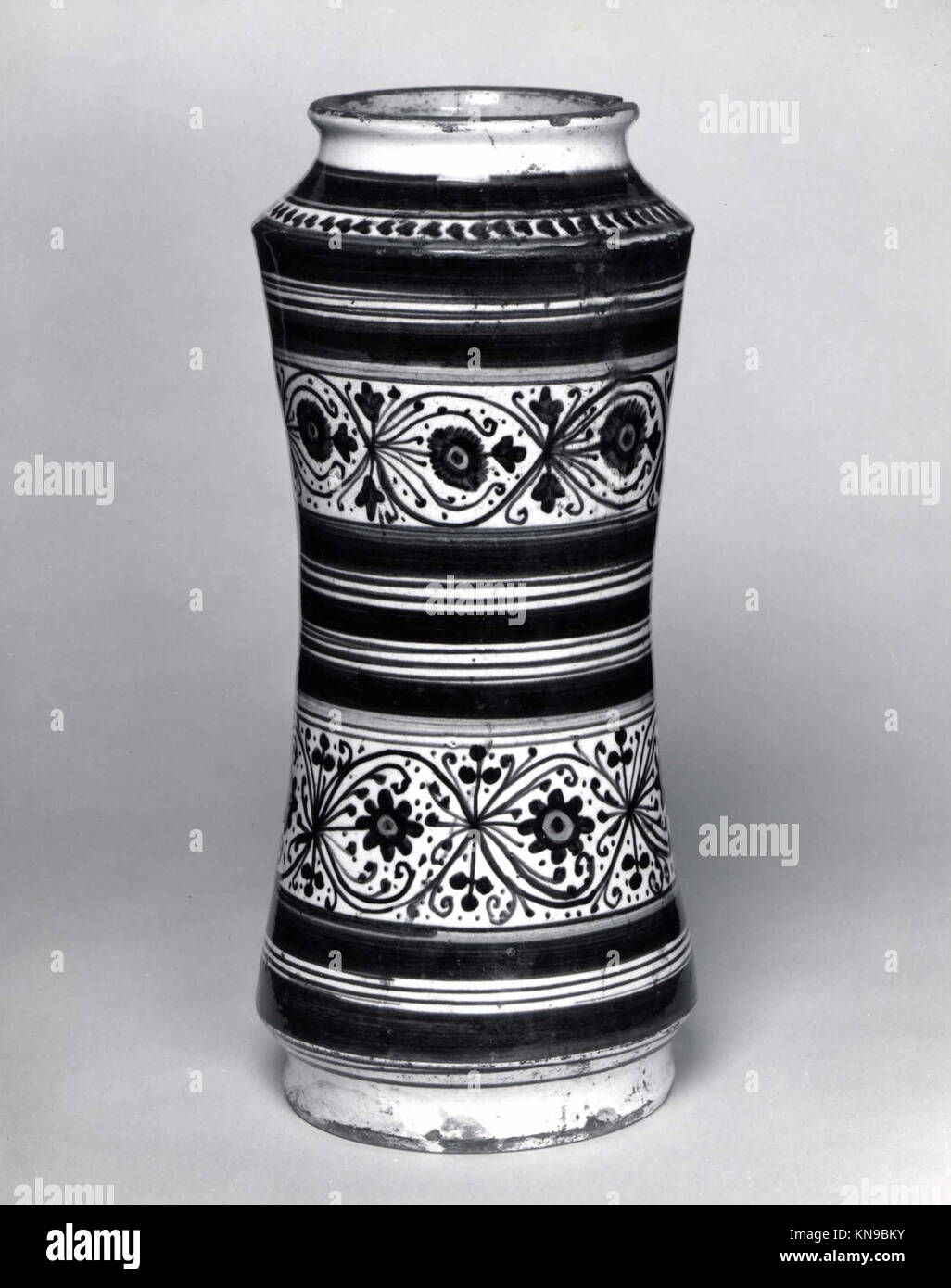 This apothecary jar, known as an albarello, is an Italian ceramic ...