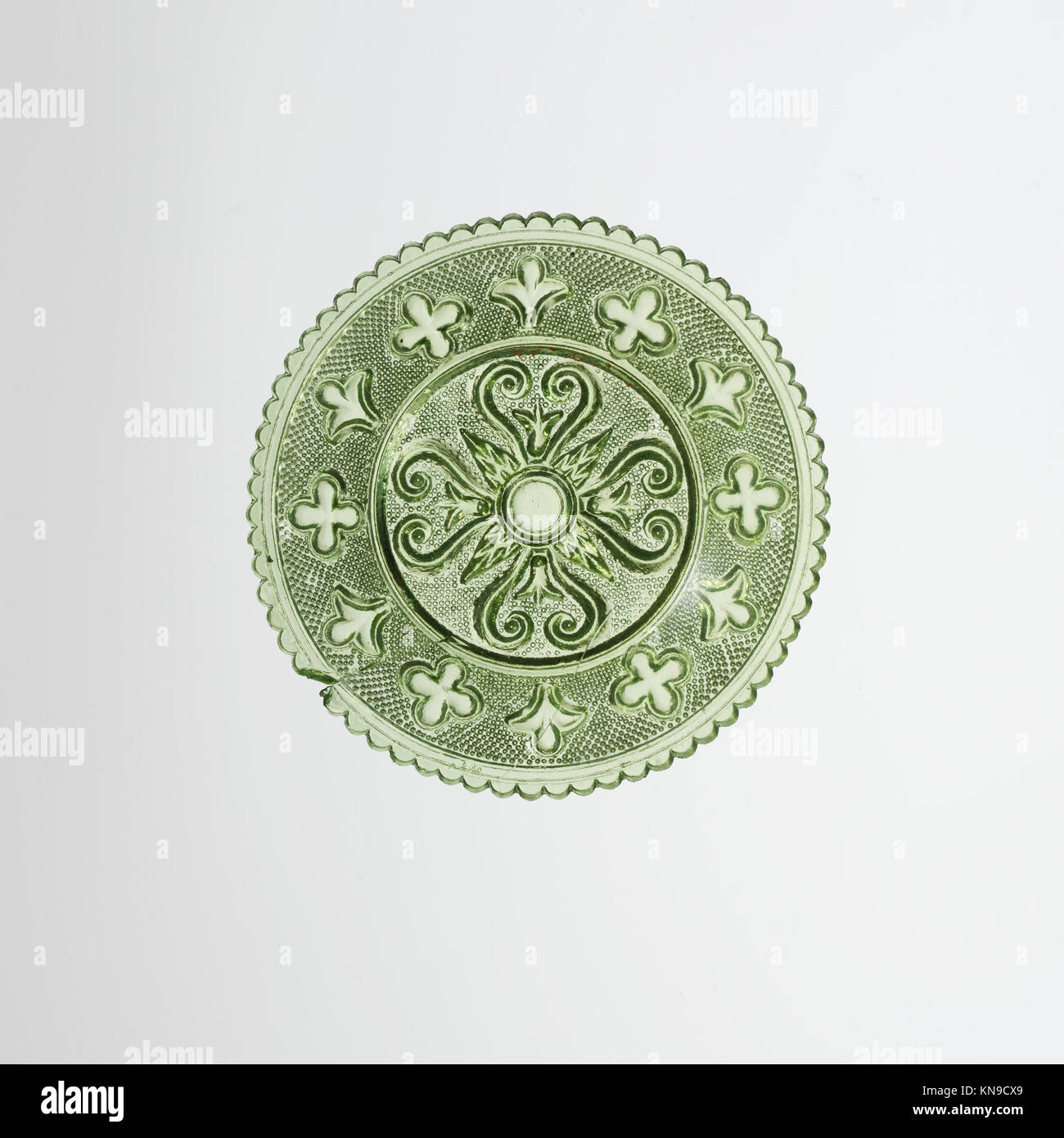 This American cup plate, crafted from lacy pressed glass, dates from ...