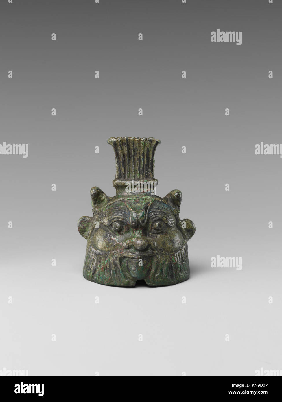 This bell, shaped in the form of the ancient Egyptian god Bes, was used ...