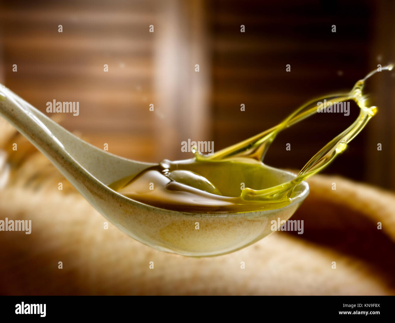 extra virgin olive oil poured Stock Photo - Alamy