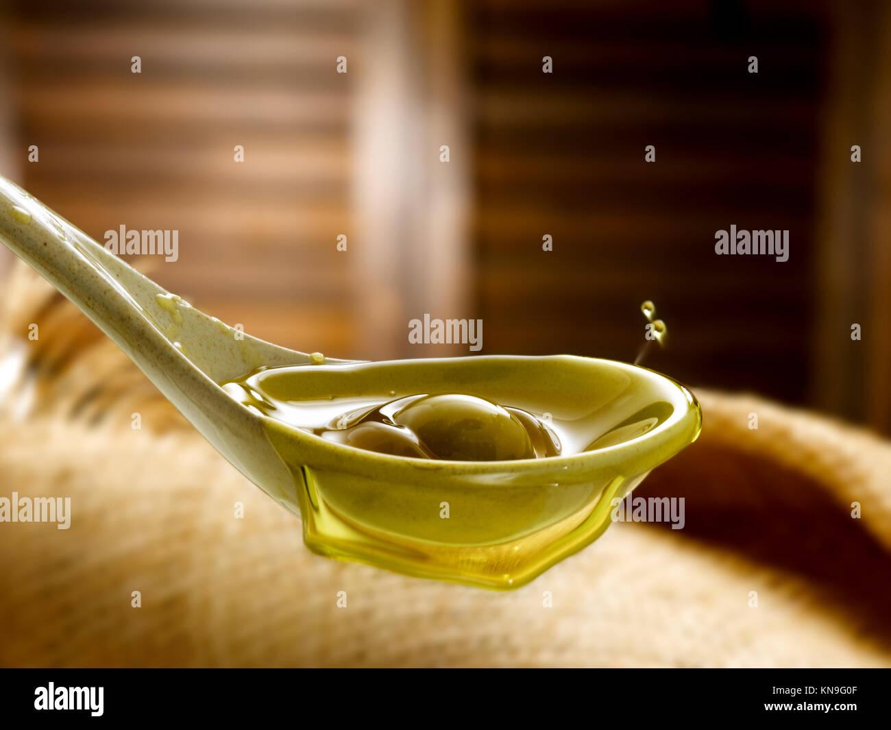 extra virgin olive oil poured Stock Photo - Alamy
