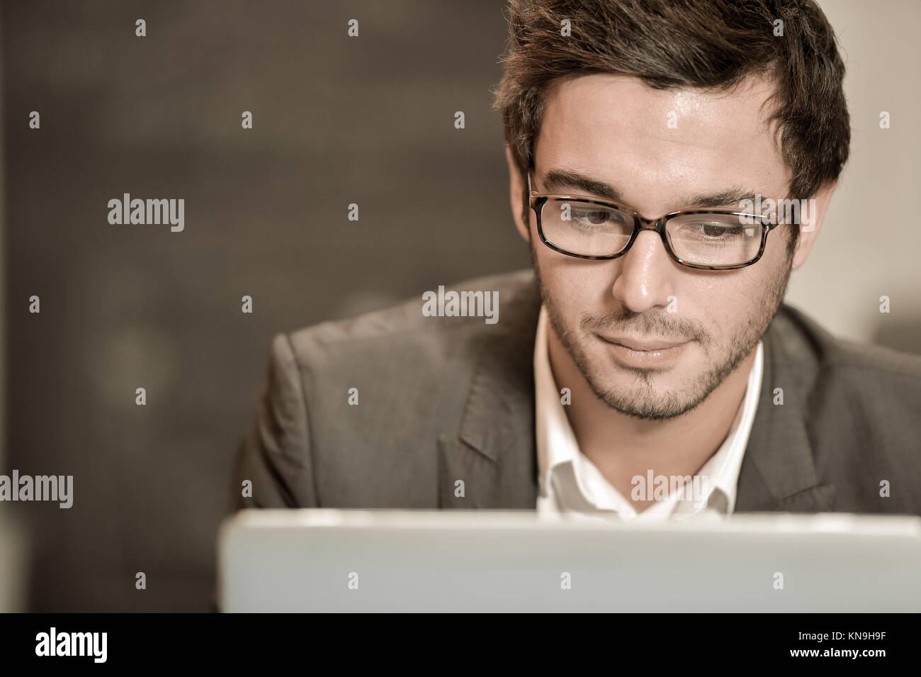 Portrait of smiling Businessman posing in modern office Stock Photo - Alamy