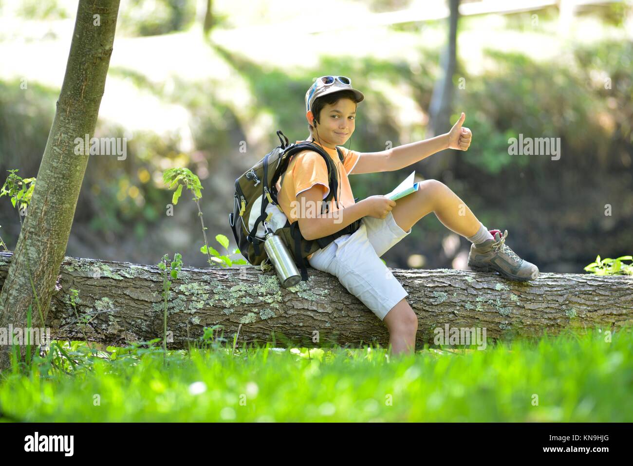 Young boy seeking his path on a map during a hike Stock Photo - Alamy