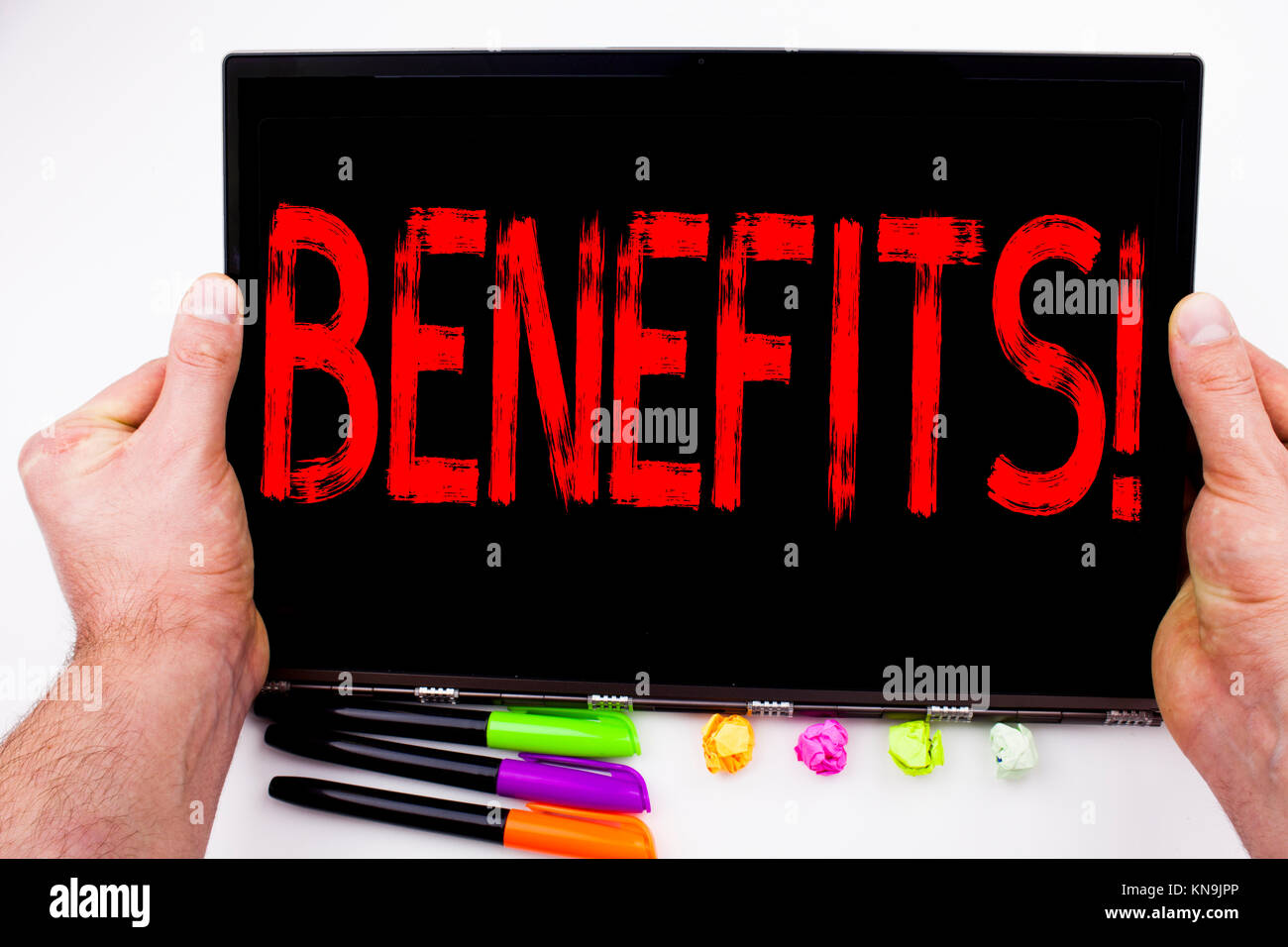 Benefits text written on tablet, computer in the office with marker ...
