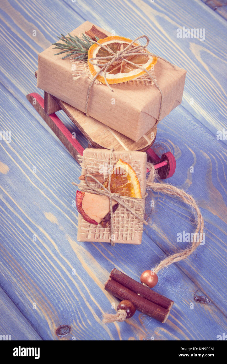 Vintage photo, Wooden sled, wrapped gifts with string and decoration ...