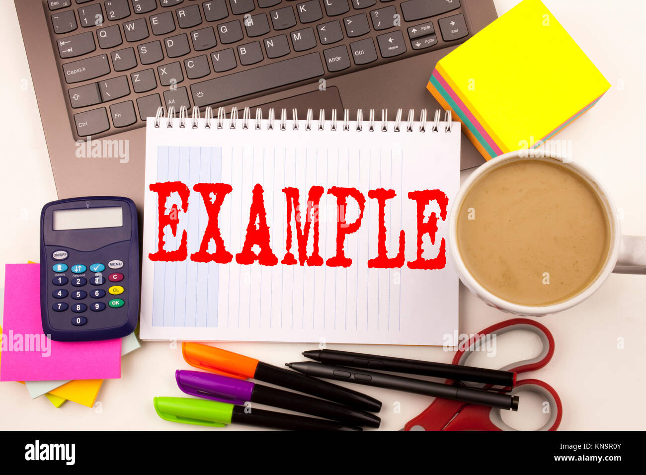 Word writing Example in the office with laptop, marker, pen, stationery ...