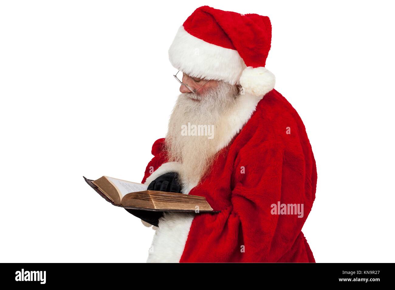 Santa reading a book hi-res stock photography and images - Alamy