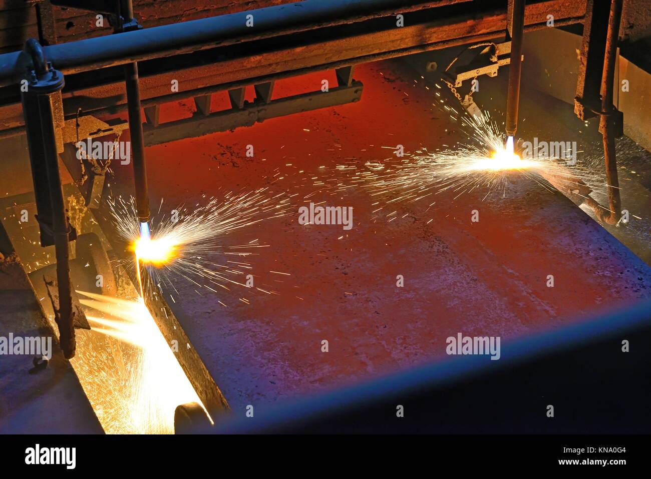 gas cutting steel plate on conveyor Stock Photo - Alamy