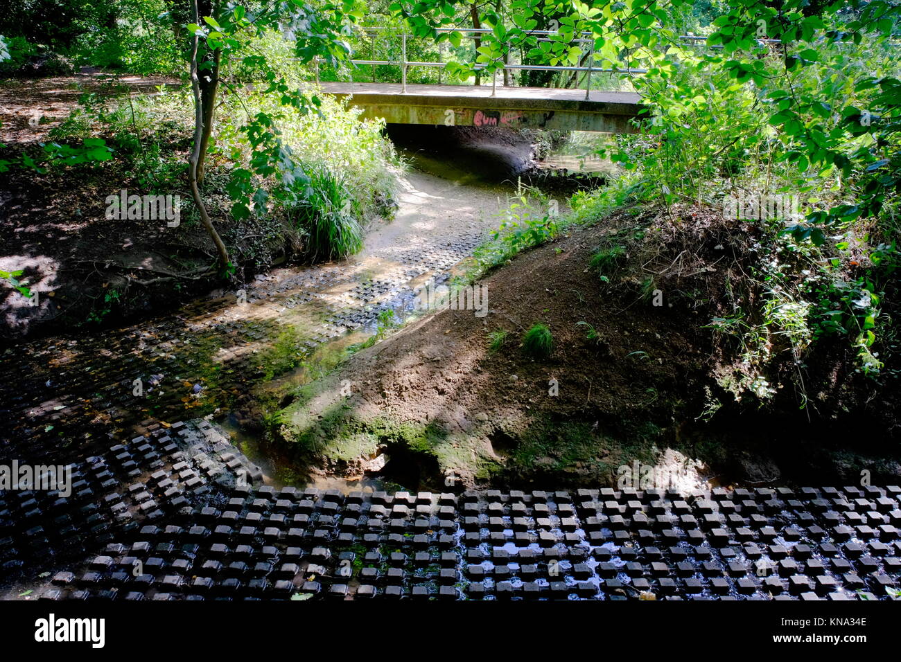 Concrete erosion defence grid on a stream bed in Hertfordshire, England ...