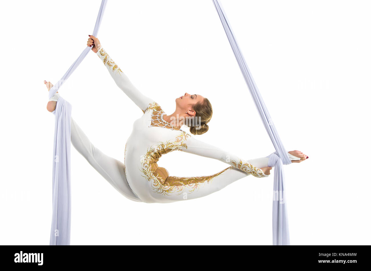 Pretty woman - aerialist performing aerial tricks on aerial silks ...