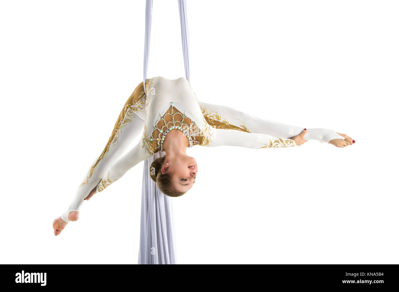 Pretty woman - aerialist performing aerial tricks on aerial silks ...
