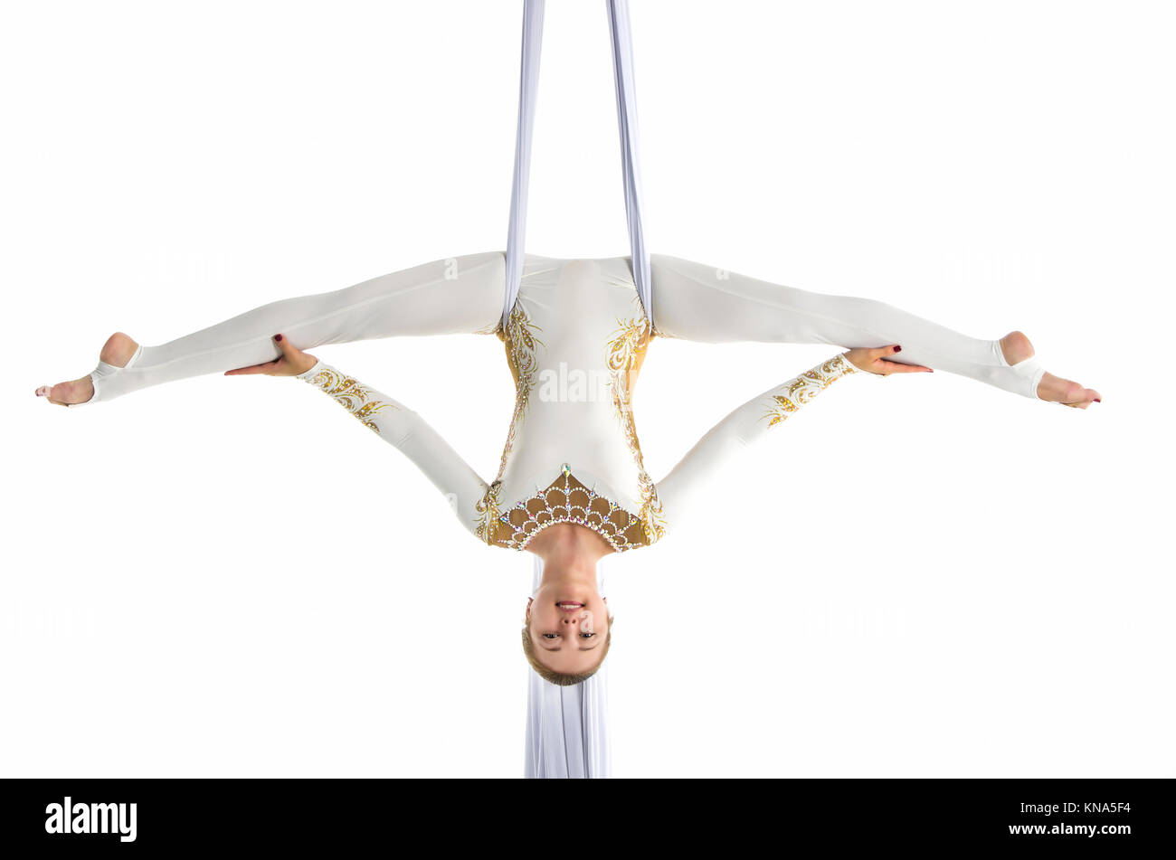 Pretty woman - aerialist performing aerial tricks on aerial silks ...