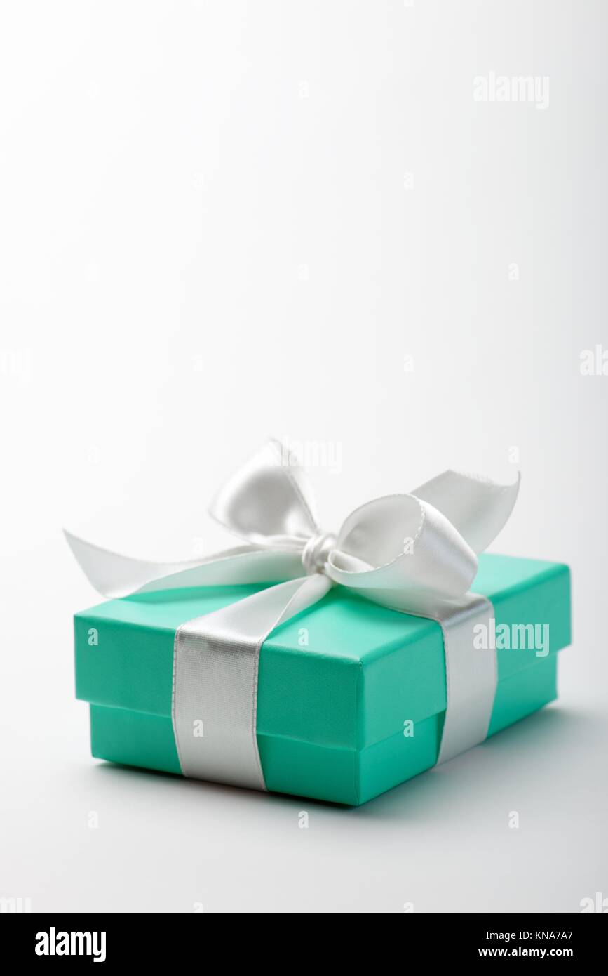 Luxury box tied with a white ribbon Stock Photo - Alamy