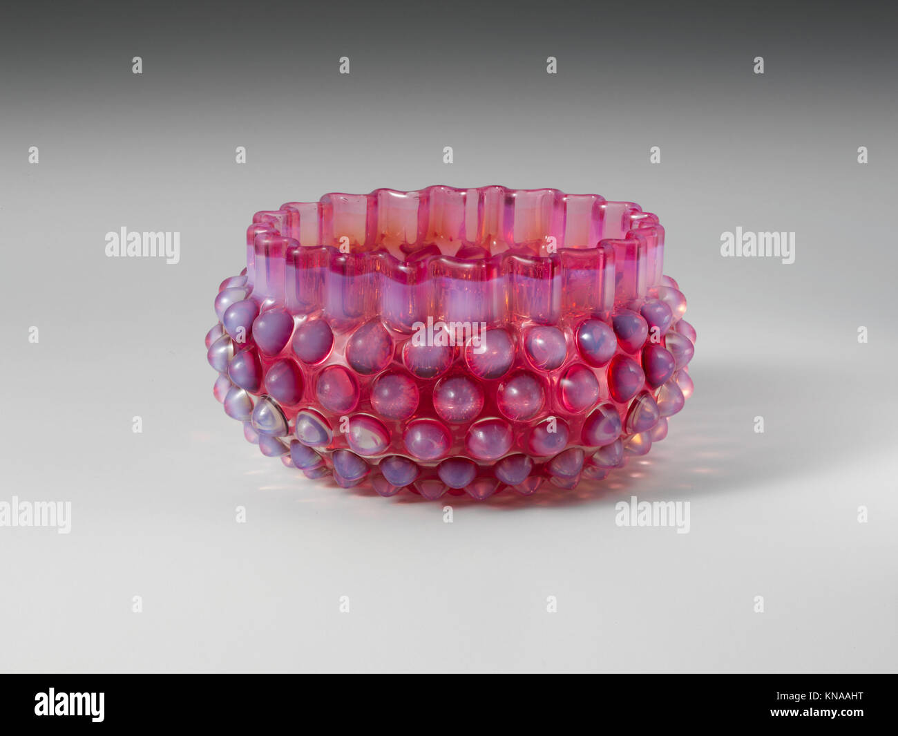 This hobnail finger bowl features a textured surface, used in ...