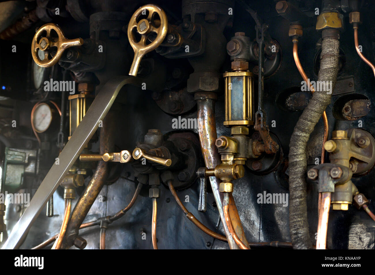 Brass instruments and controls inside a steam train Stock Photo - Alamy