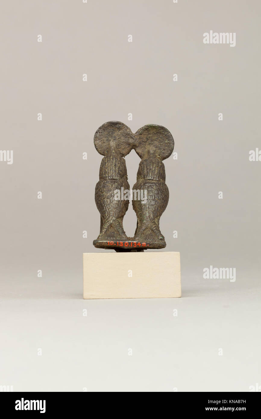 This artifact features a double ba-bird design, representing the ba, or ...