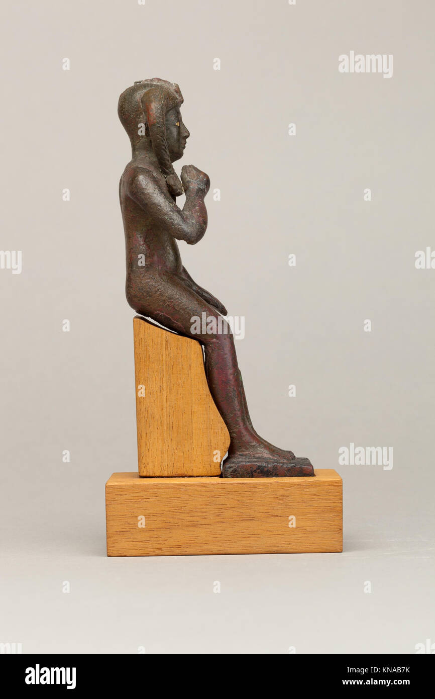 The artifact represents a child deity, sculpted in a traditional style ...