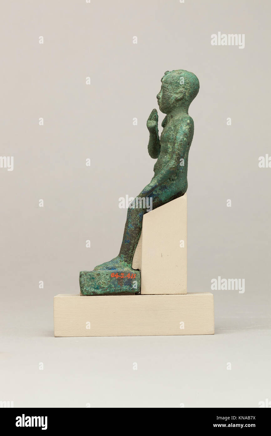 A statue of a child god, representing a deity in ancient religious ...