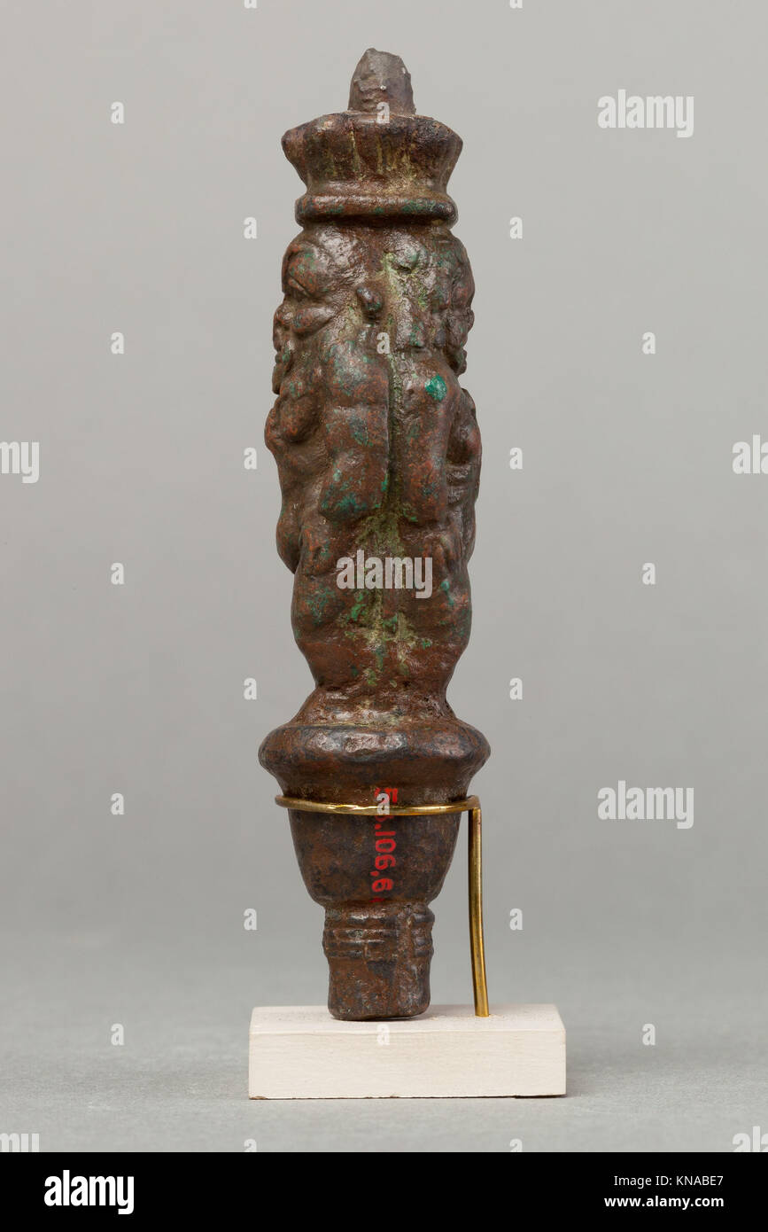 This artwork shows Bes on a papyriform capital with Beset opposite ...