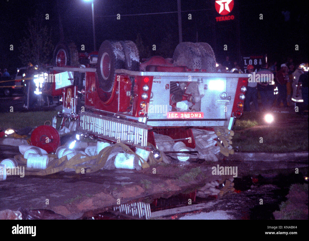 Overturned fire truck Stock Photo - Alamy