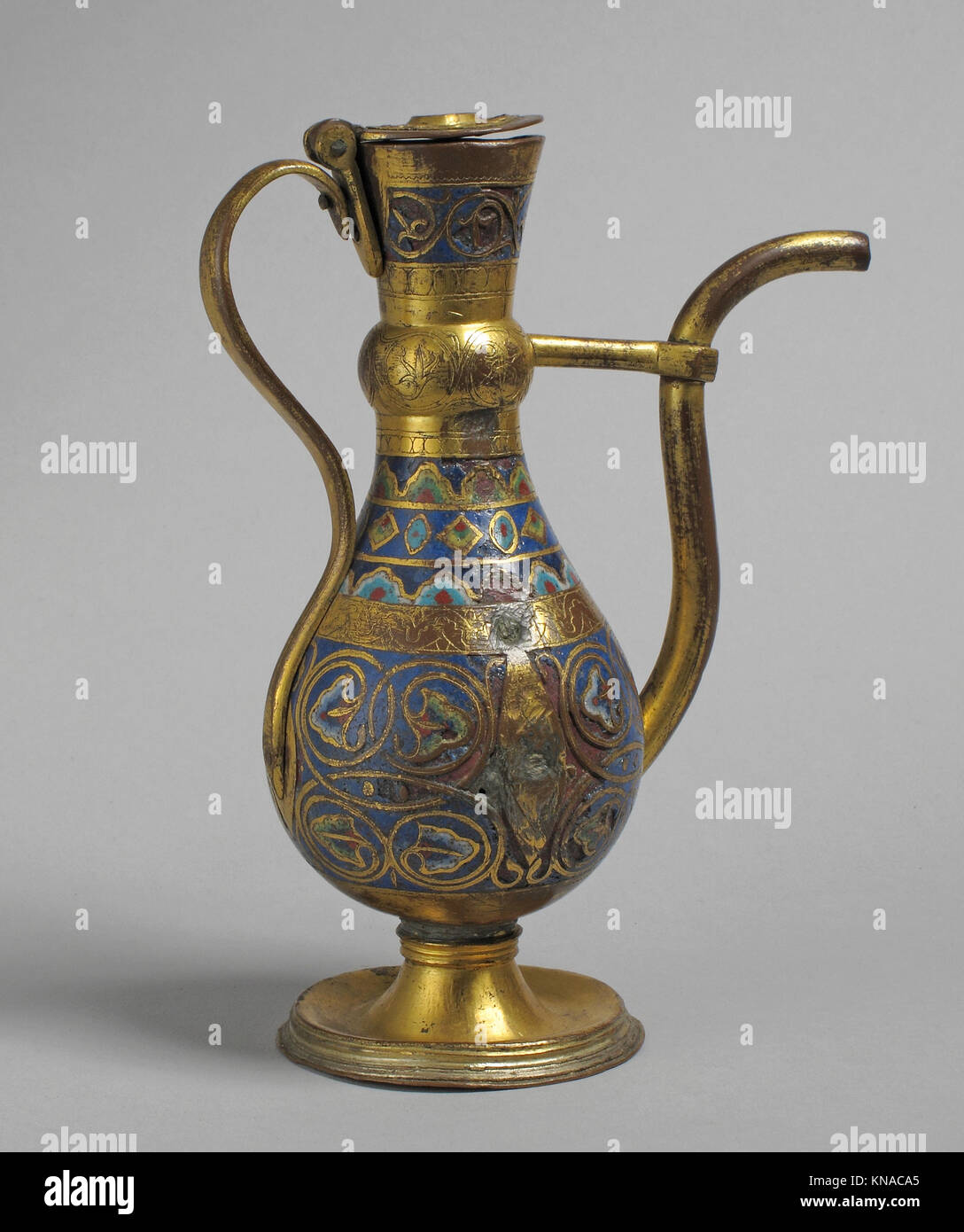 This altar cruet, used in religious ceremonies, features a simple yet ...
