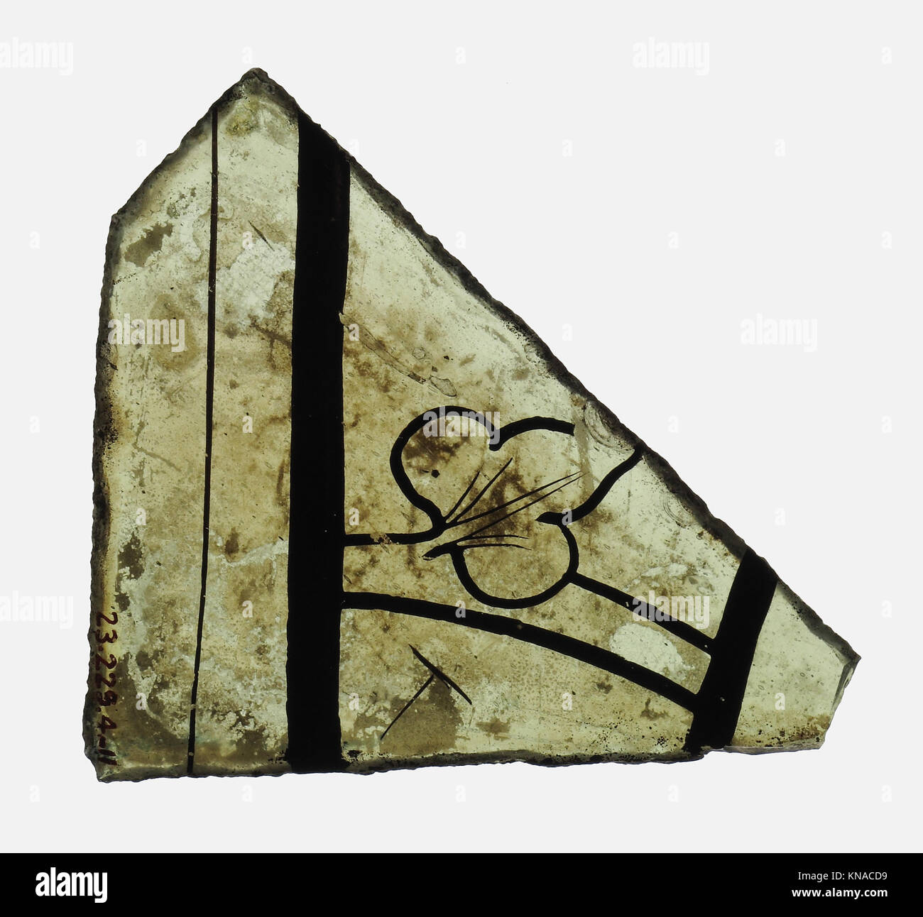 A fragment of glass, likely part of a larger vessel or object ...